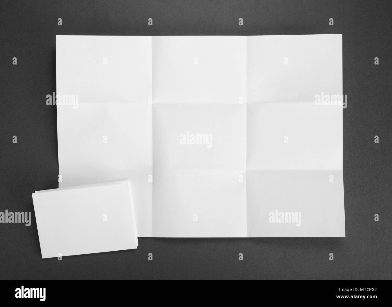 White sheet of paper folded in nine top shooting Stock Photo - Alamy