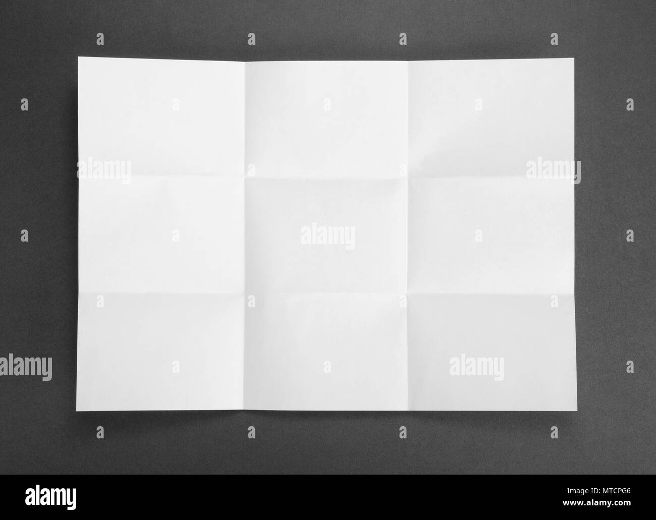 White sheet of paper folded in nine top shooting Stock Photo - Alamy