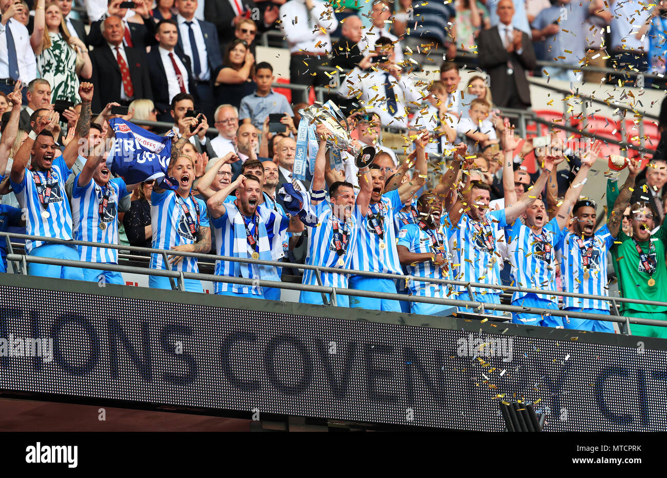 Coventry City's Michael Doyle (centre) and his team-mates lift the ...