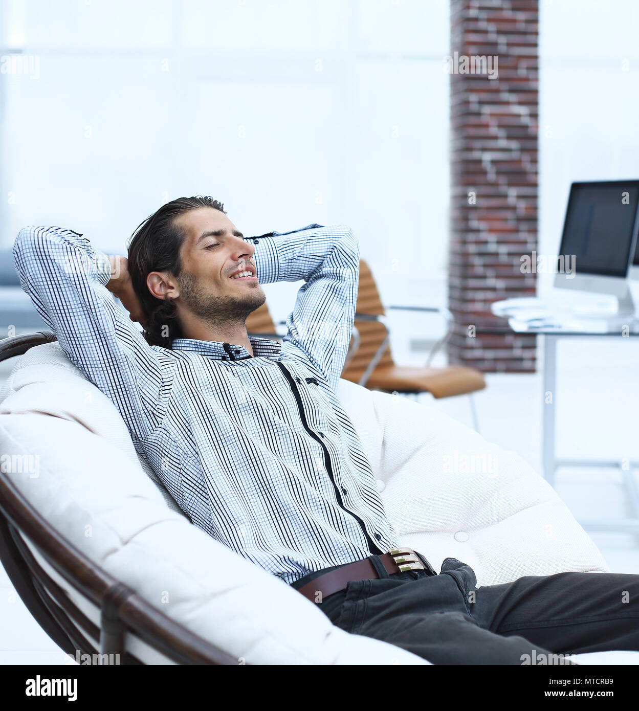 businessman relaxing in a comfortable chair Stock Photo - Alamy