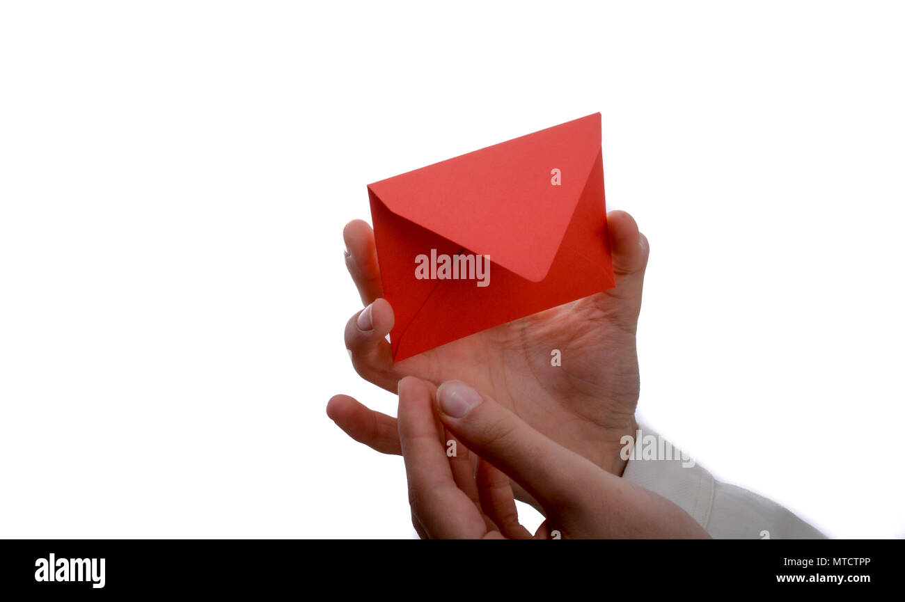 hand holding a red envelope on a white background Stock Photo - Alamy