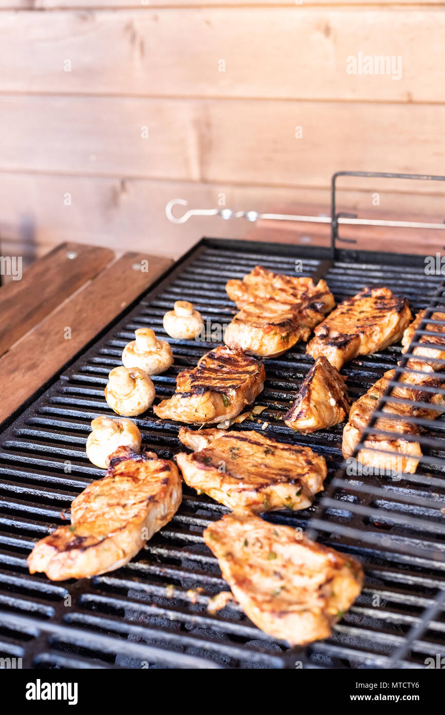 delicious grilled meat on grill. Beef steak on the grill grate, flames ...
