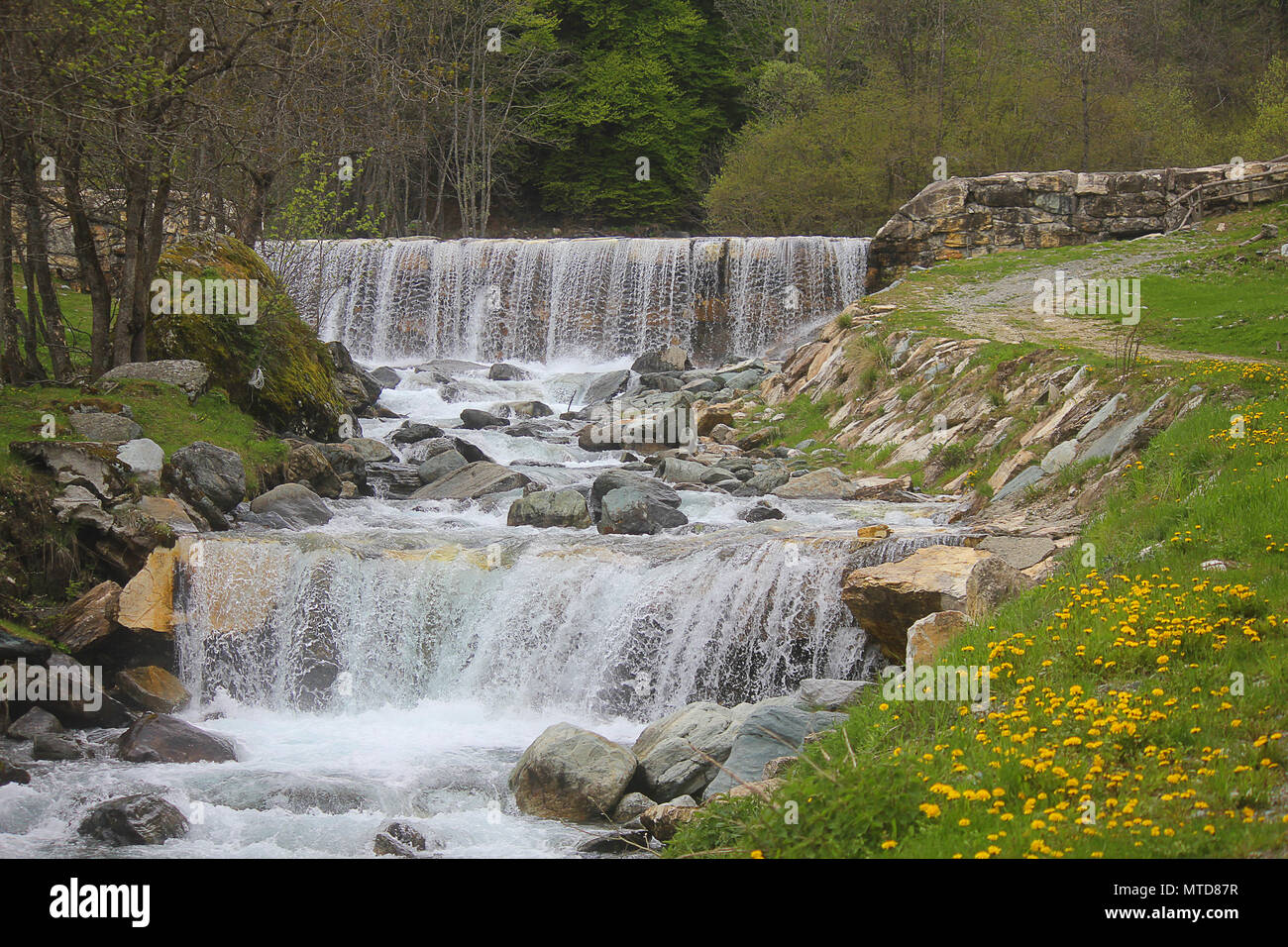 panorama of waterfalls in mountains among the meadows Stock Photo - Alamy