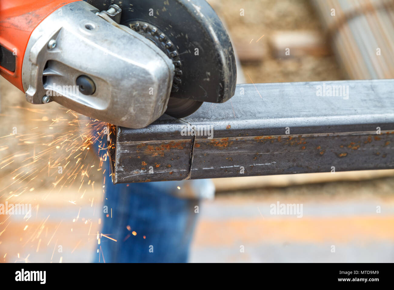 Cutting steel heavy industry by electric flex Stock Photo - Alamy