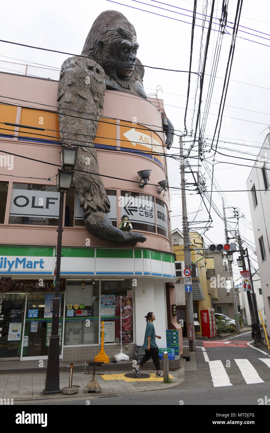 Tokyo, Japan. 30th May, 2018. A giant gorilla holding a school girl in ...