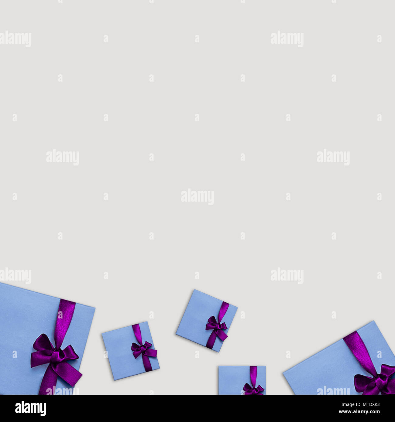 Gift boxes Trendy photo Blue gift boxes with lilac ribbons are lying on ...