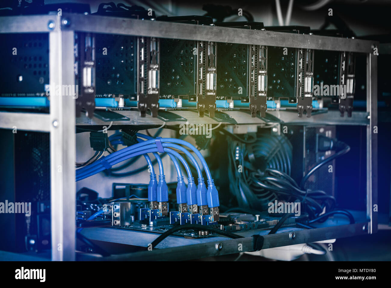 Close up details of mining rig, graphics cards cables and motherboard ...