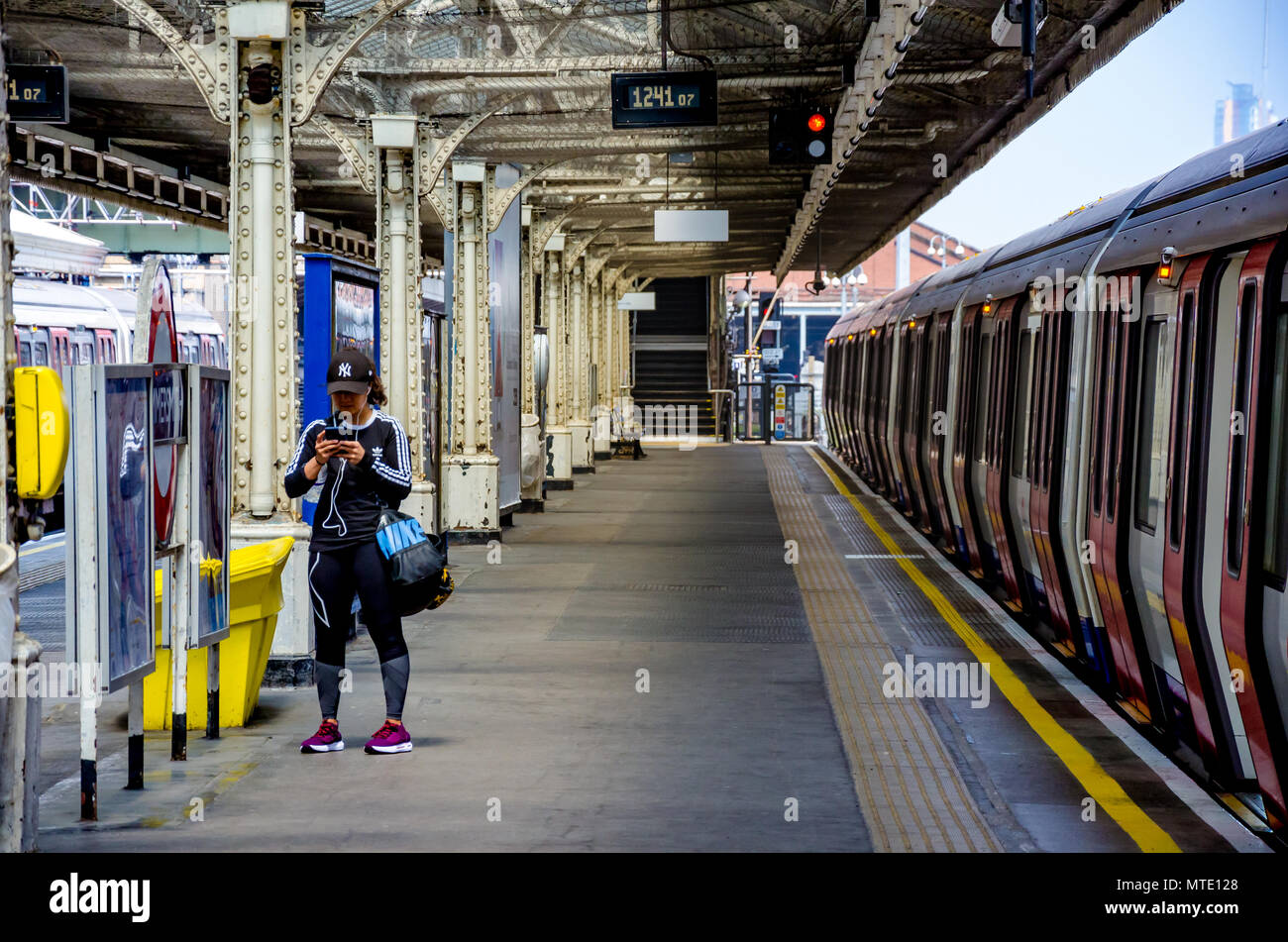 Woman alone subway station hi-res stock photography and images - Alamy