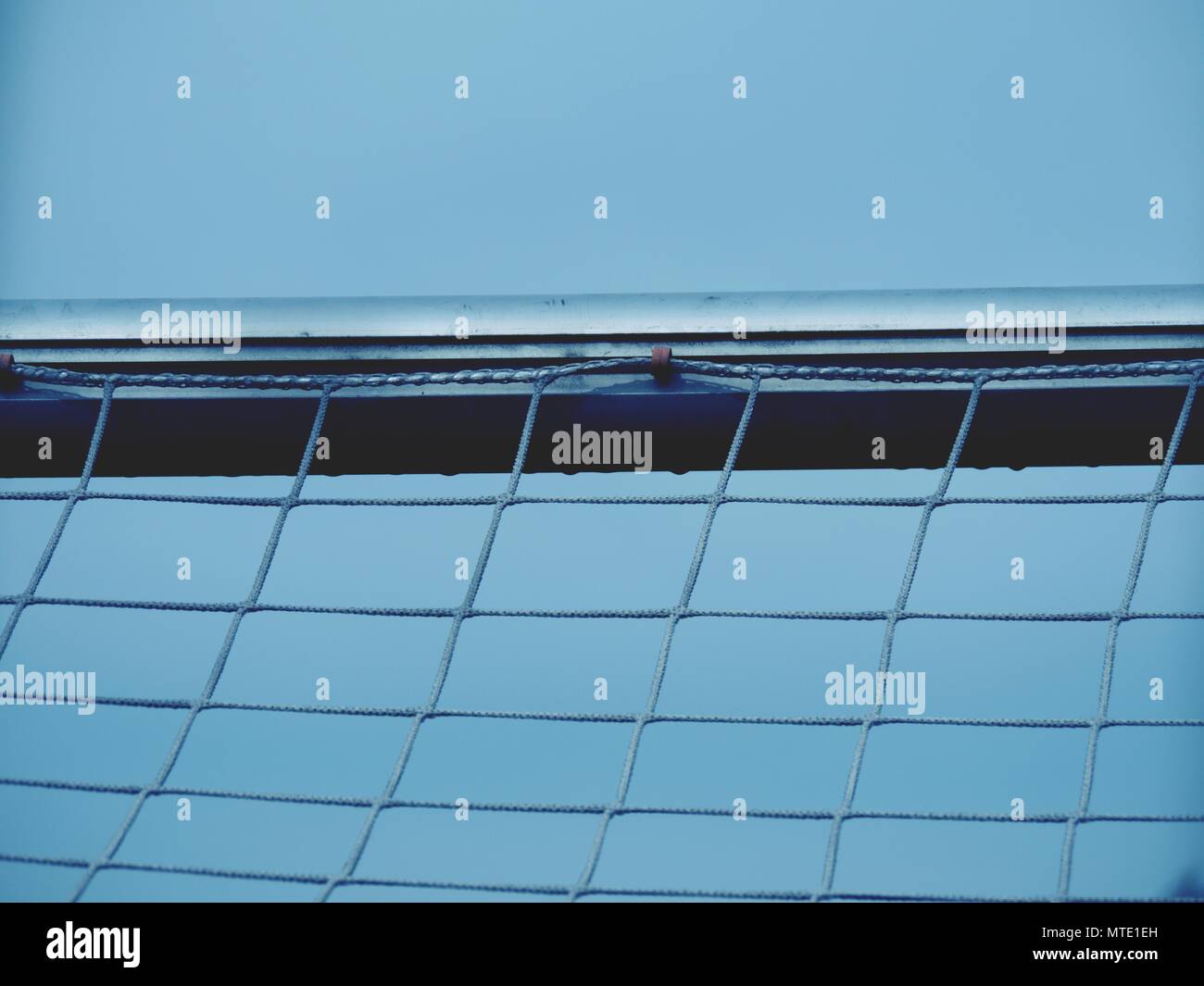 Hang bended white black soccer nets soccer football net. Grass on ...