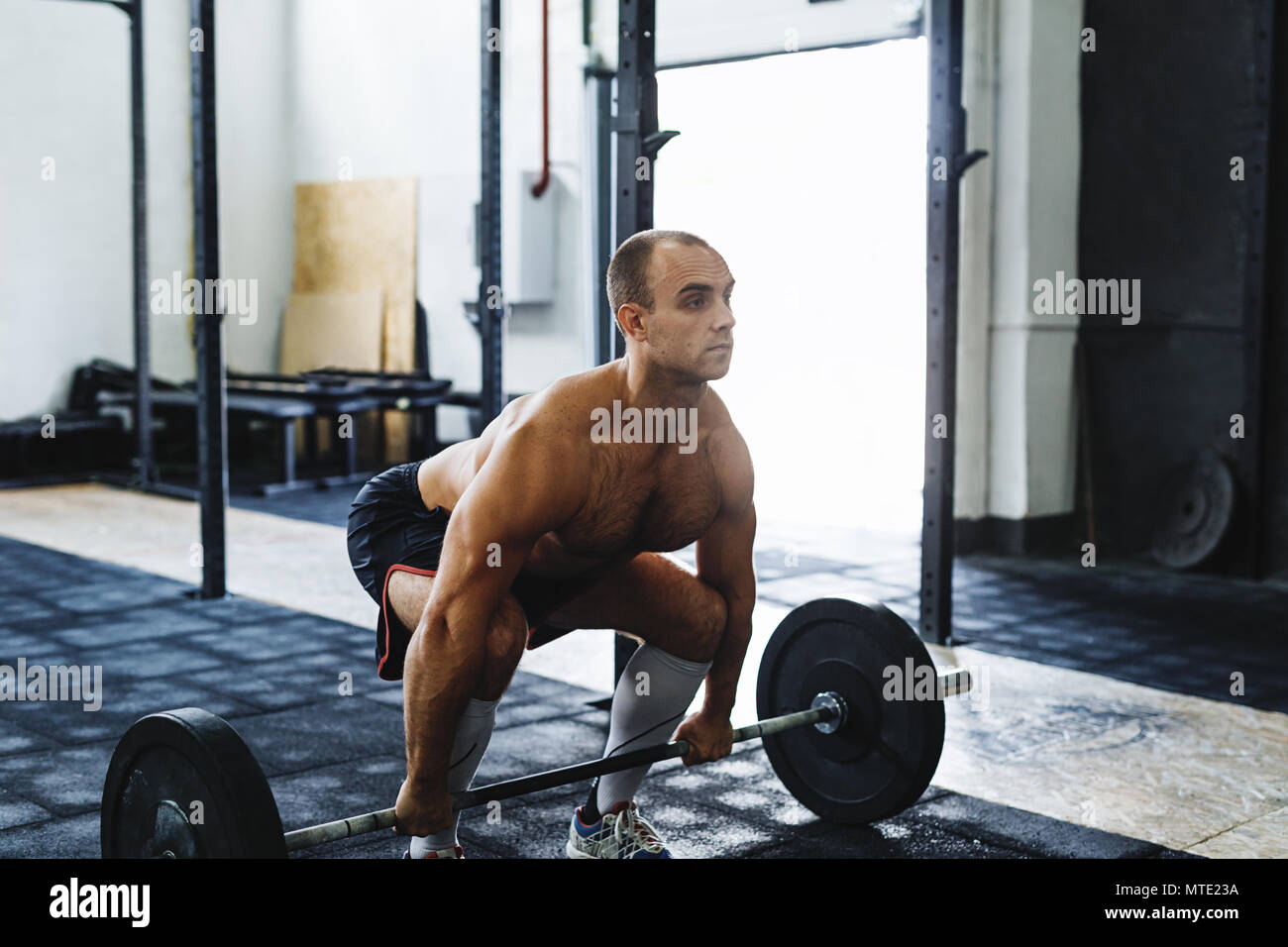 Shot of young bodybuilder working out at gym Stock Photo - Alamy