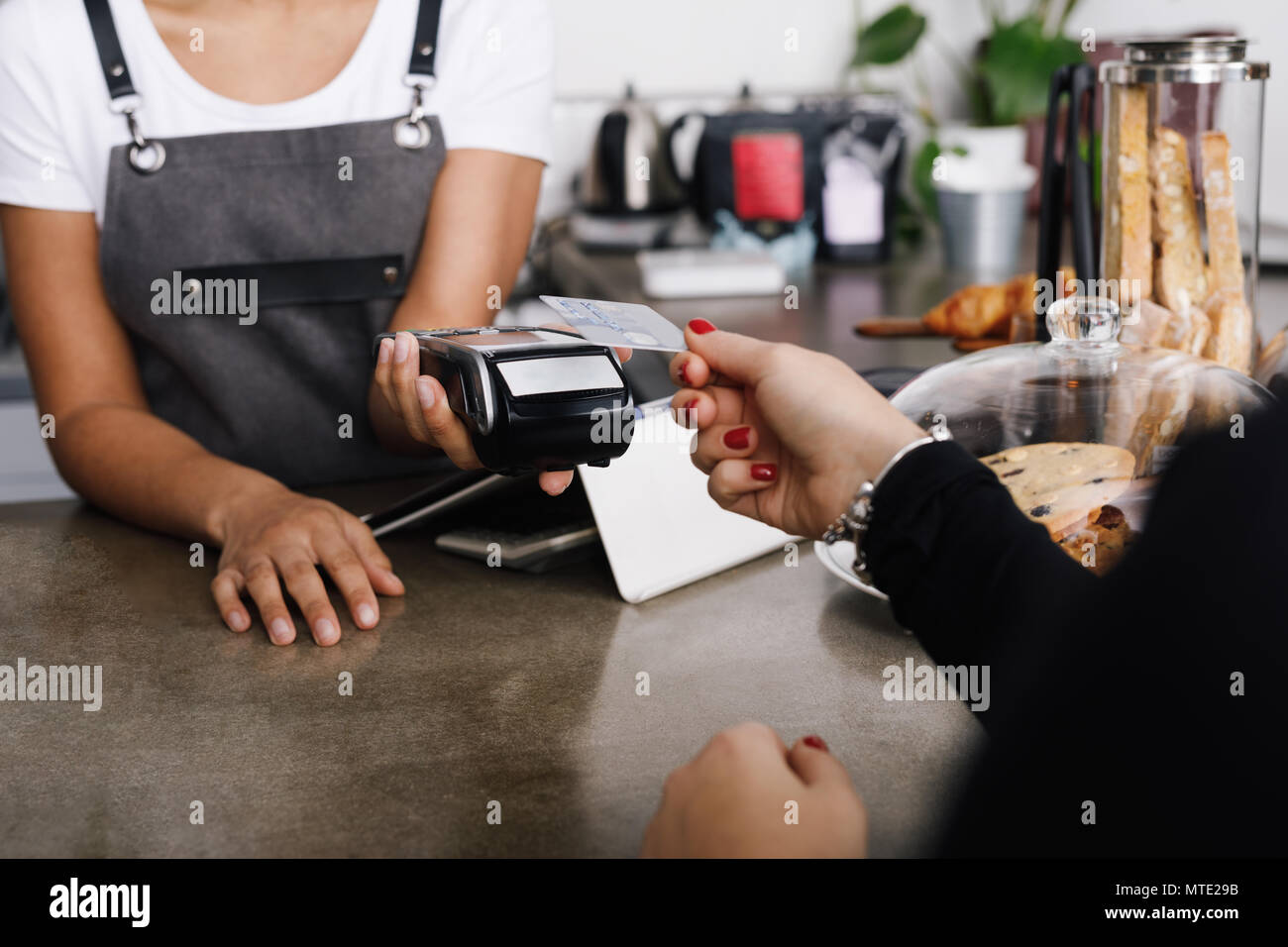 Customer making payment using hi-res stock photography and images - Alamy