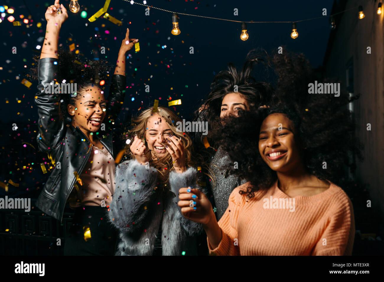 Friends throwing confetti birthday party hi-res stock photography and ...
