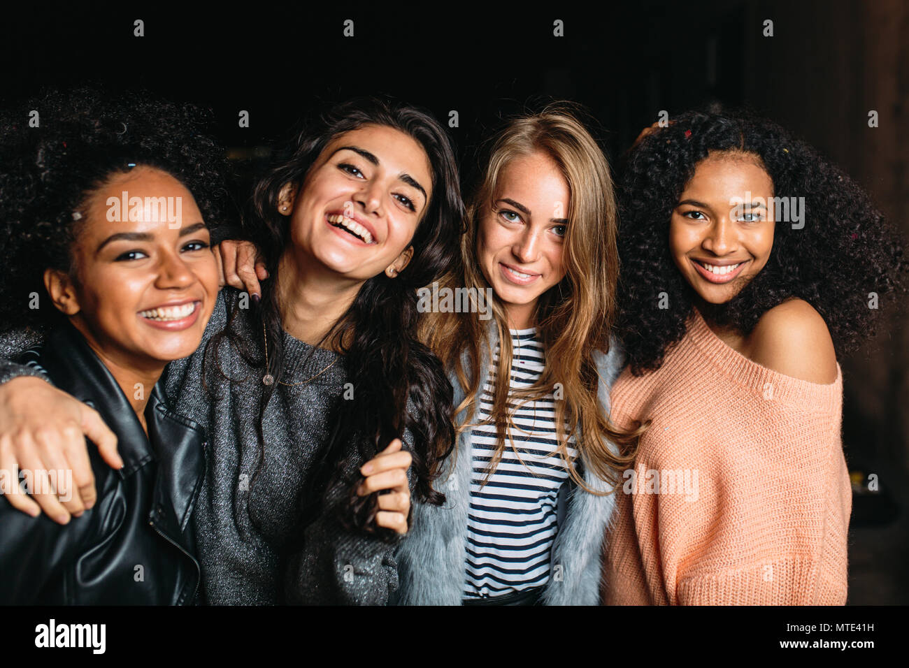 Best friends standing outdoors, looking at camera Stock Photo - Alamy