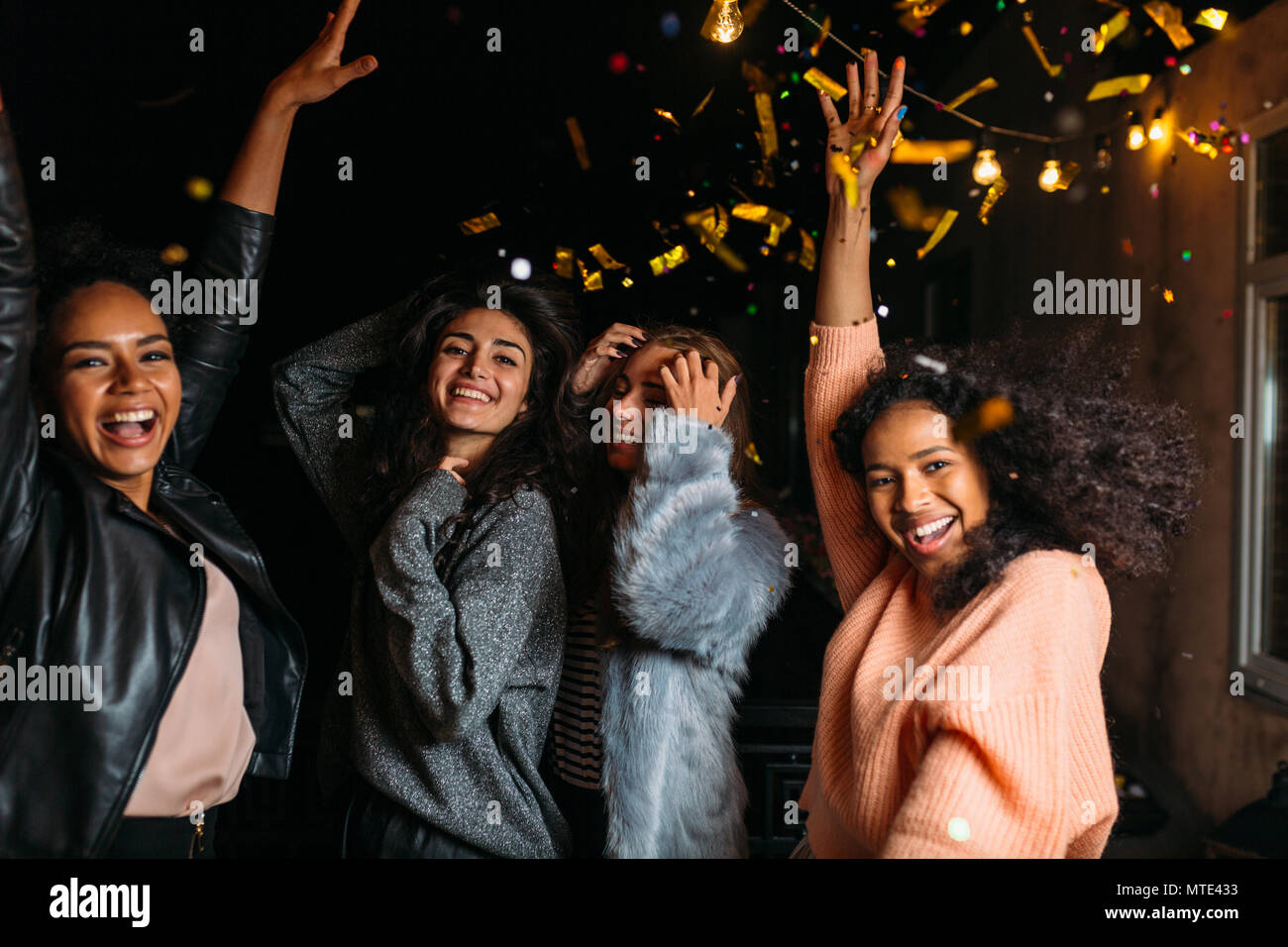 Group of young women hanging out together, dancing outdoors Stock Photo ...