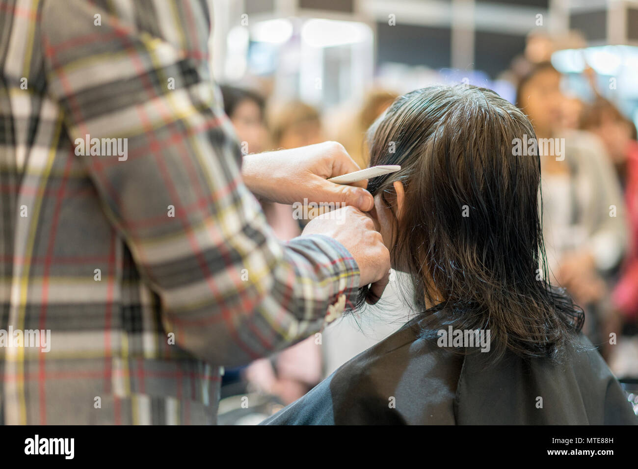 Barbershop. Close-up of man haircut, master does hair styling in barber ...