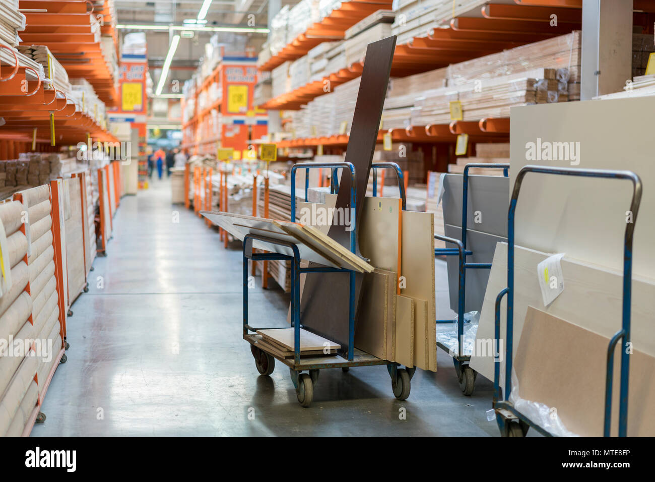 construction cart in the building store. Carts loaded with boards Stock ...