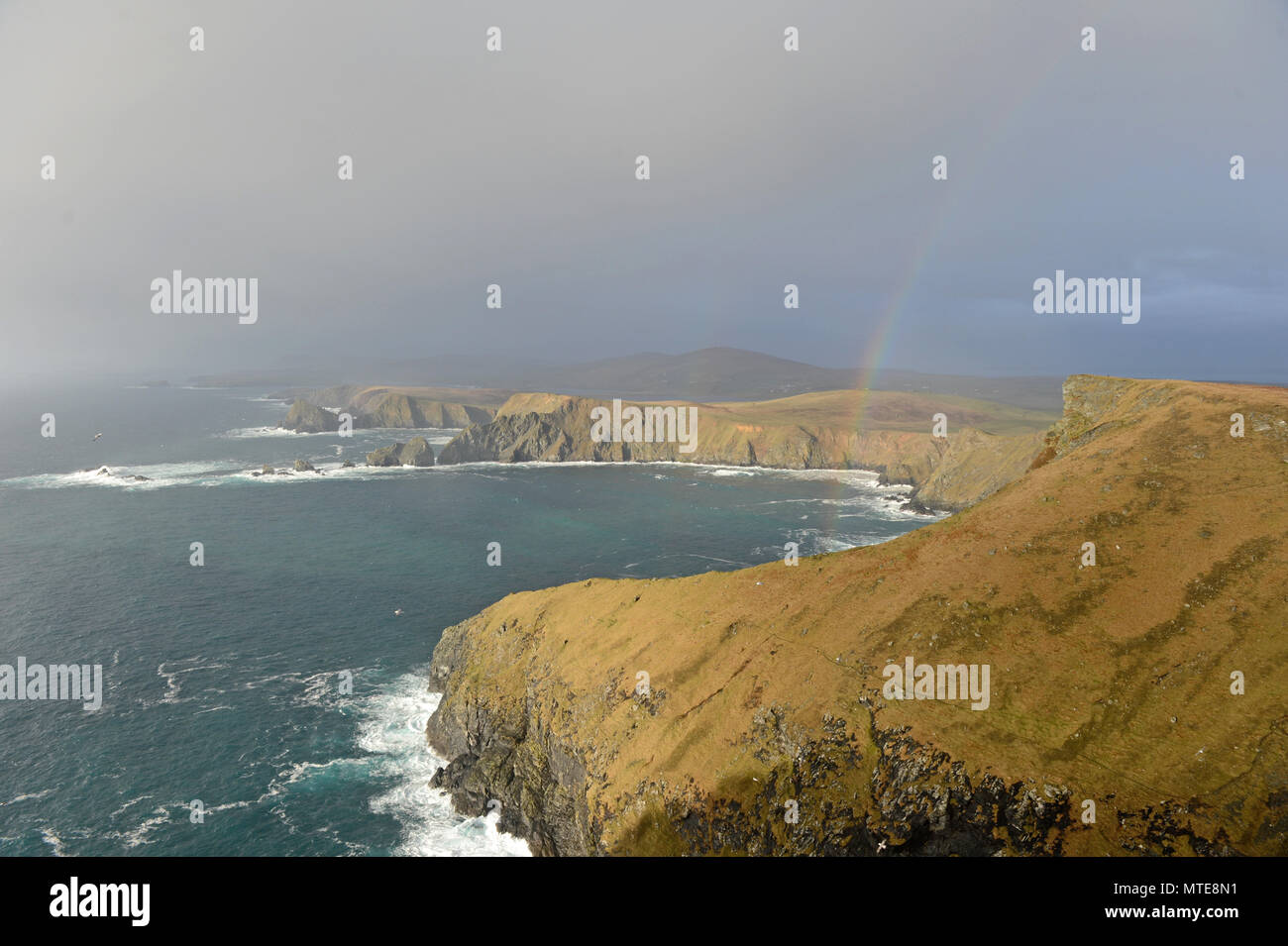 High up cliff shots of the sea and land in Shetland with a storm and a ...