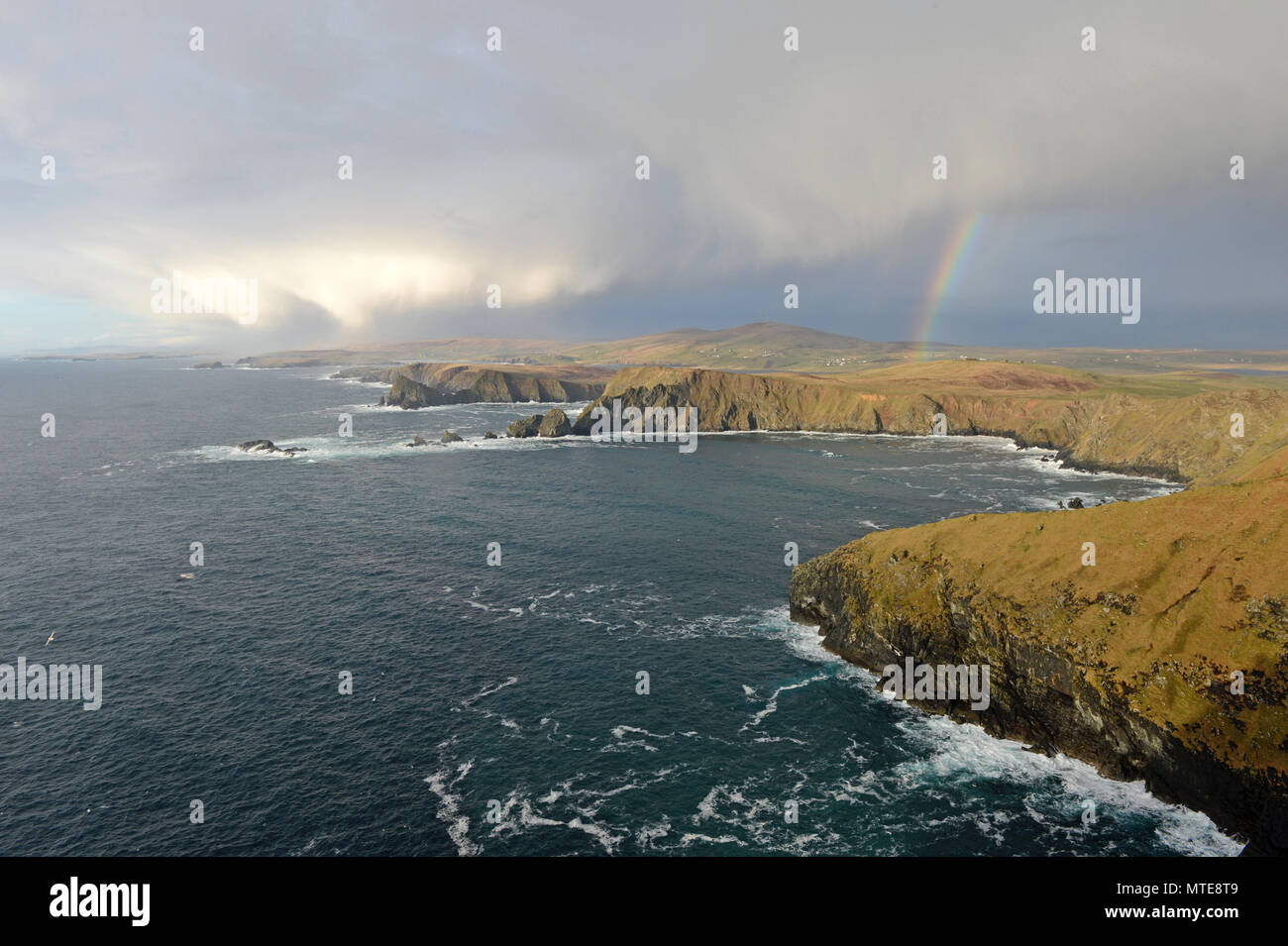 High up cliff shots of the sea and land in Shetland with a storm and a ...