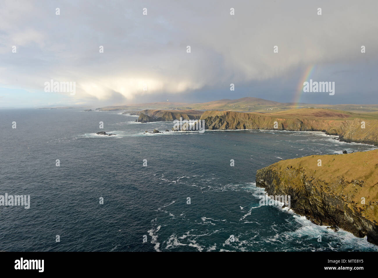 High up cliff shots of the sea and land in Shetland with a storm and a ...