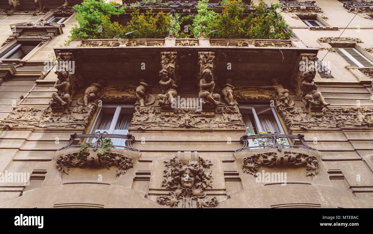 Facade of building in Porta Venezia neighbourhood. Ornamental humanist ...
