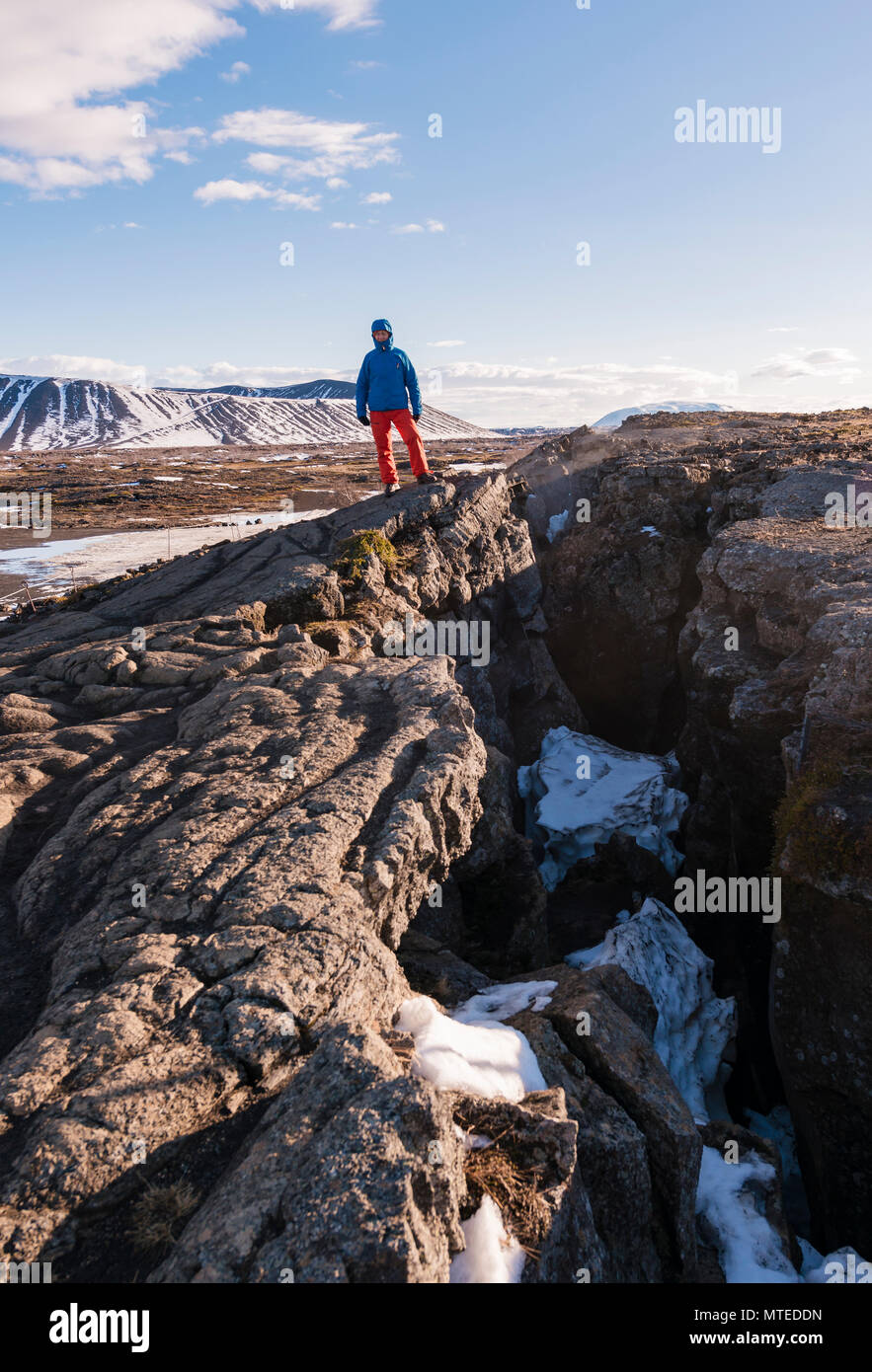 Man stands at Continental Rift between North American and Eurasian ...