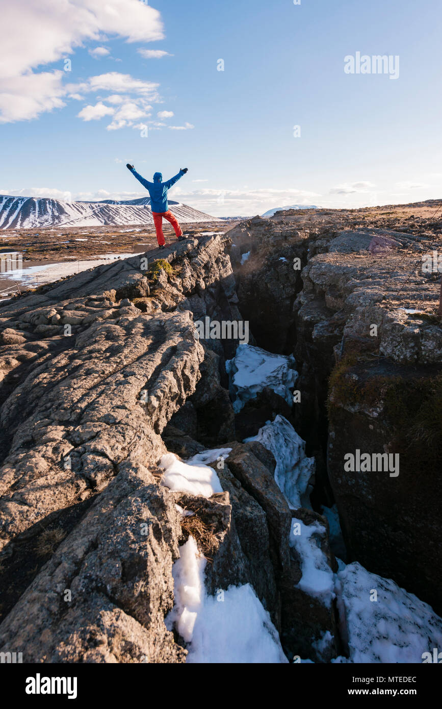 Man stands at Continental Rift between North American and Eurasian ...
