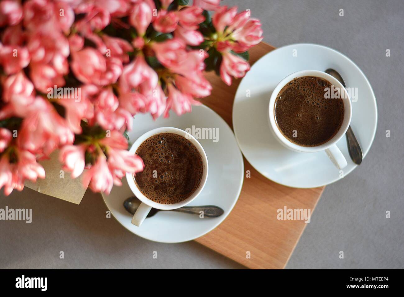 coffee in a white cup with azalea flower Stock Photo - Alamy