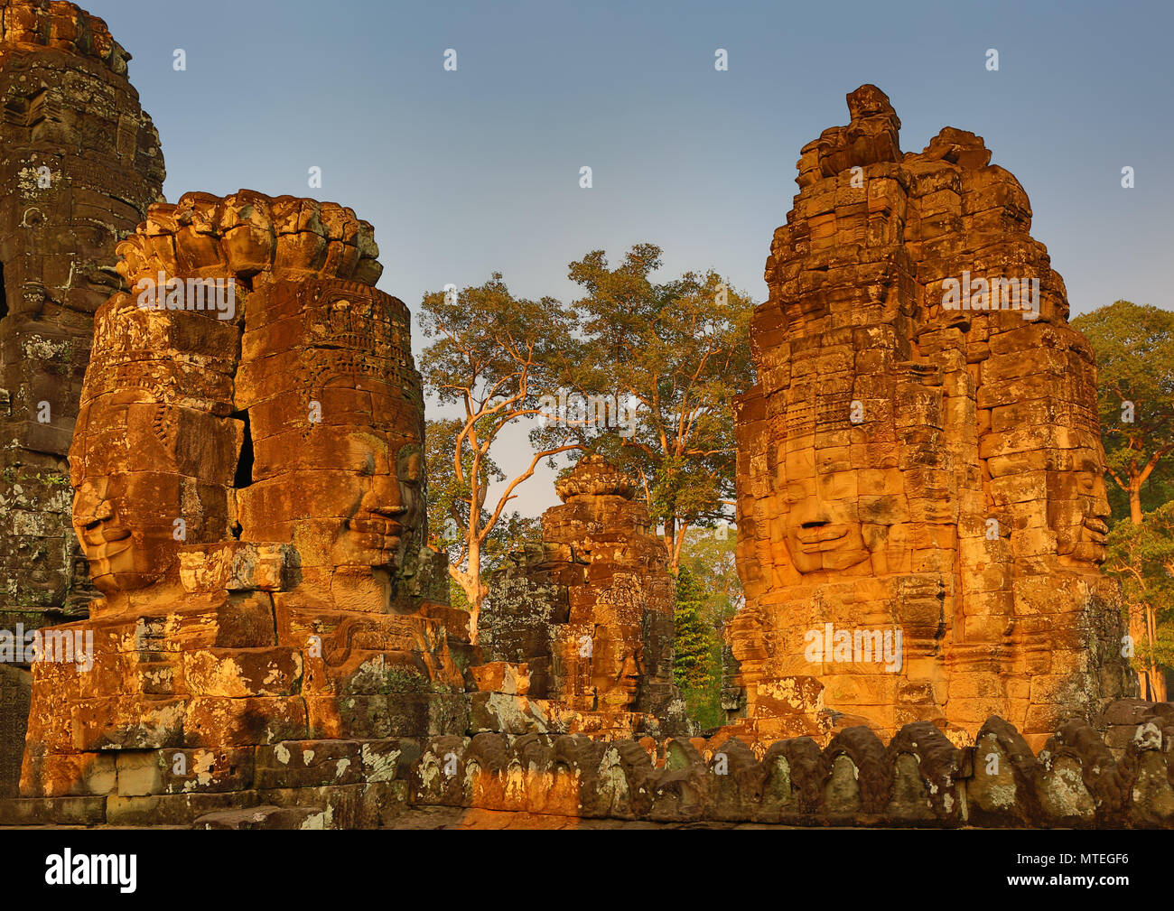Giant stone faces at Bayon Temple in Cambodia Stock Photo - Alamy