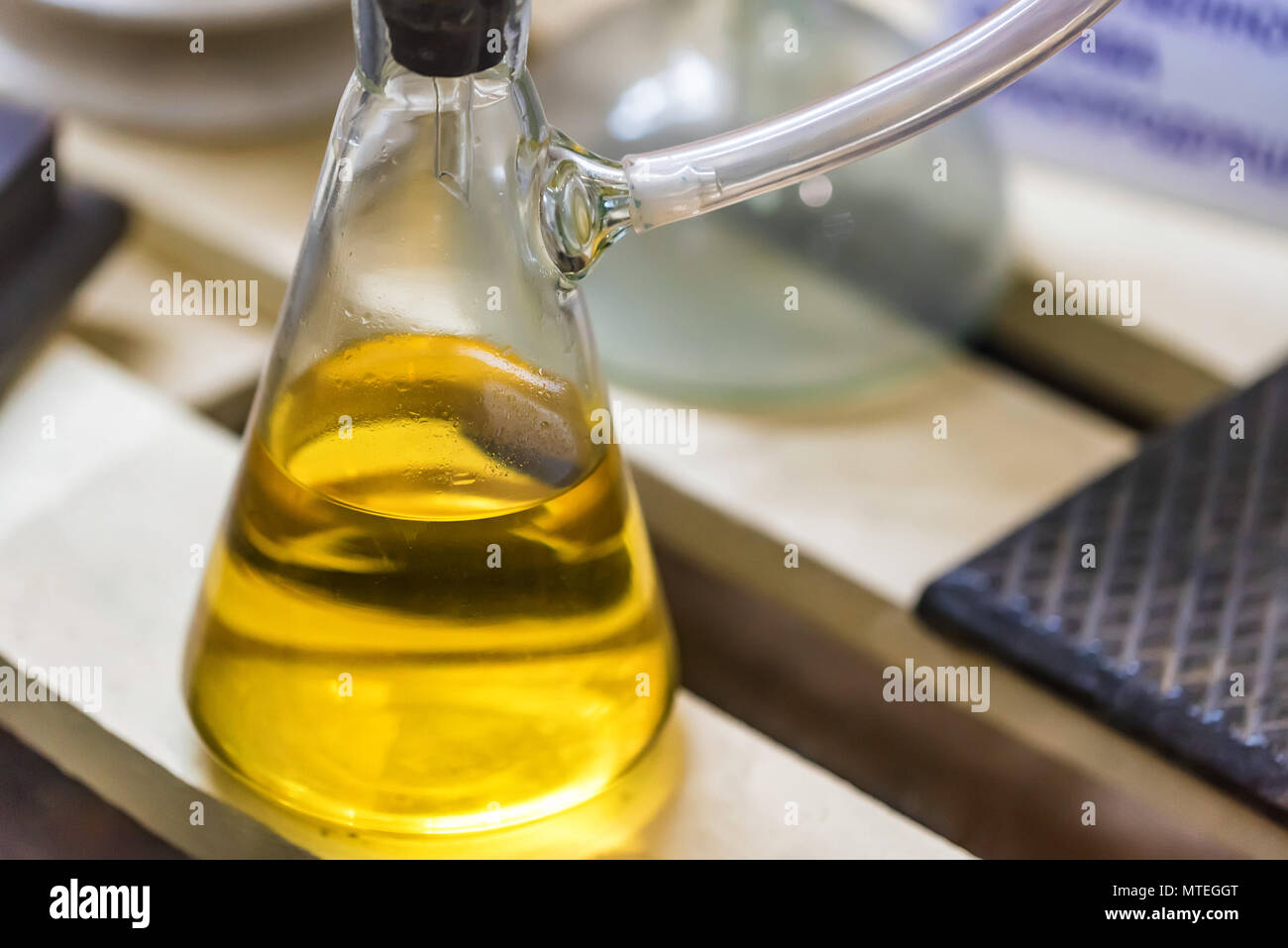 Flask with white wine in industrial laboratory Stock Photo - Alamy