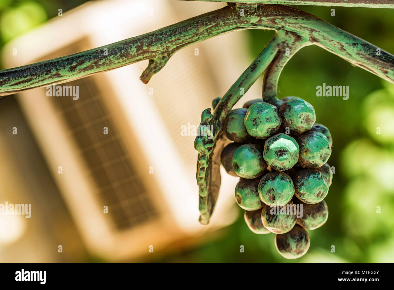 Forged metal bunch of grapes interior decoration Stock Photo - Alamy