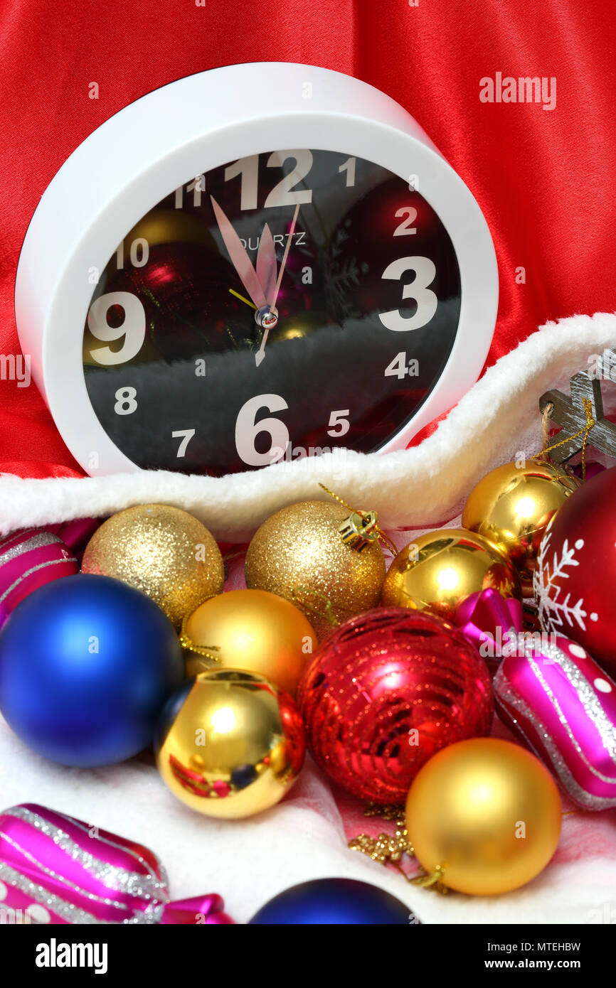 Clock and christmas balls and toys Stock Photo - Alamy