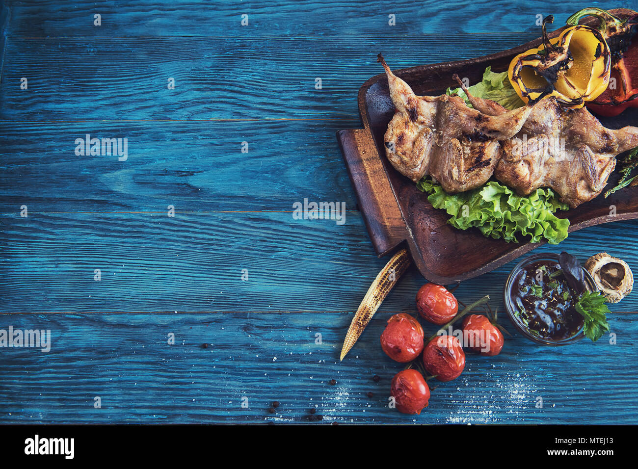 Grilled quail meat Stock Photo - Alamy