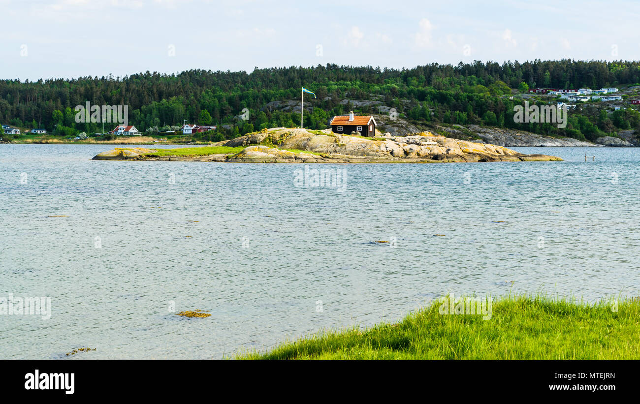 Small wooden cabin on an isolated island in the archipelago Stock Photo ...
