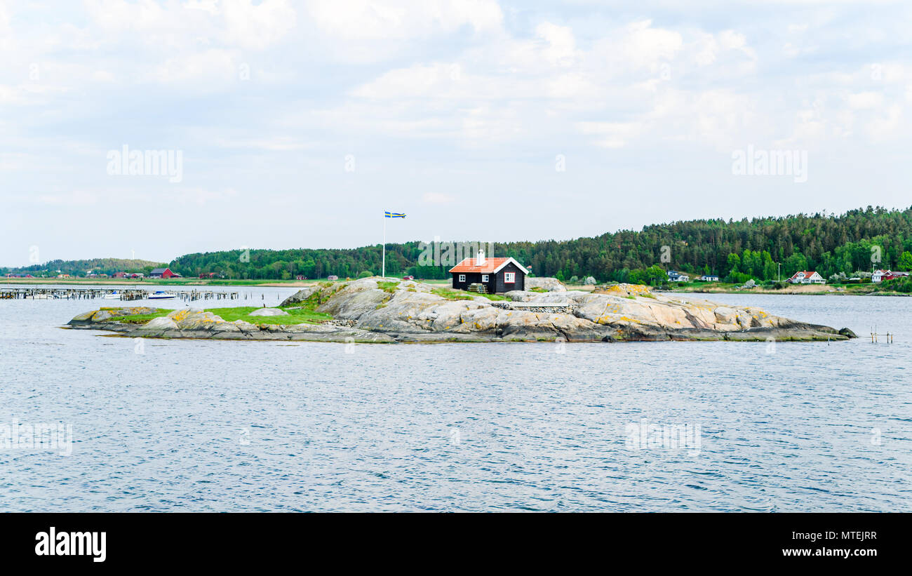 Small wooden cabin on an isolated island in the archipelago Stock Photo ...