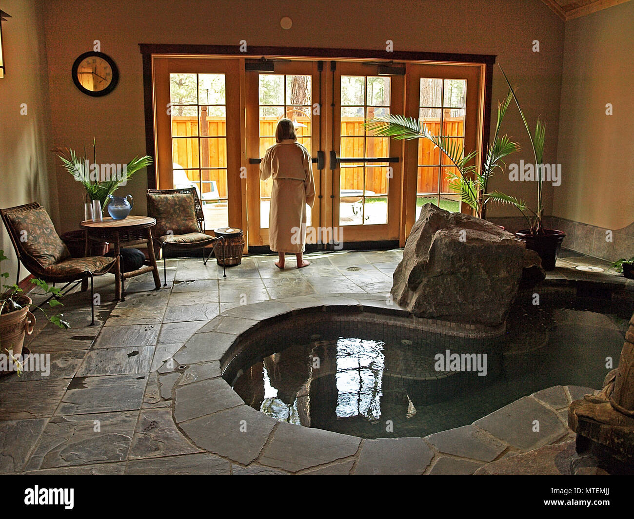 A woman prepares to soak in the hot tub at an expensive Japanese spa ...