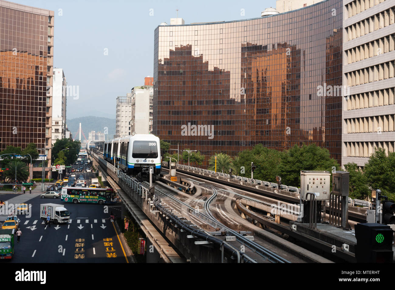 An Innovia APM 256 train traveling on elevated rails approaches the ...