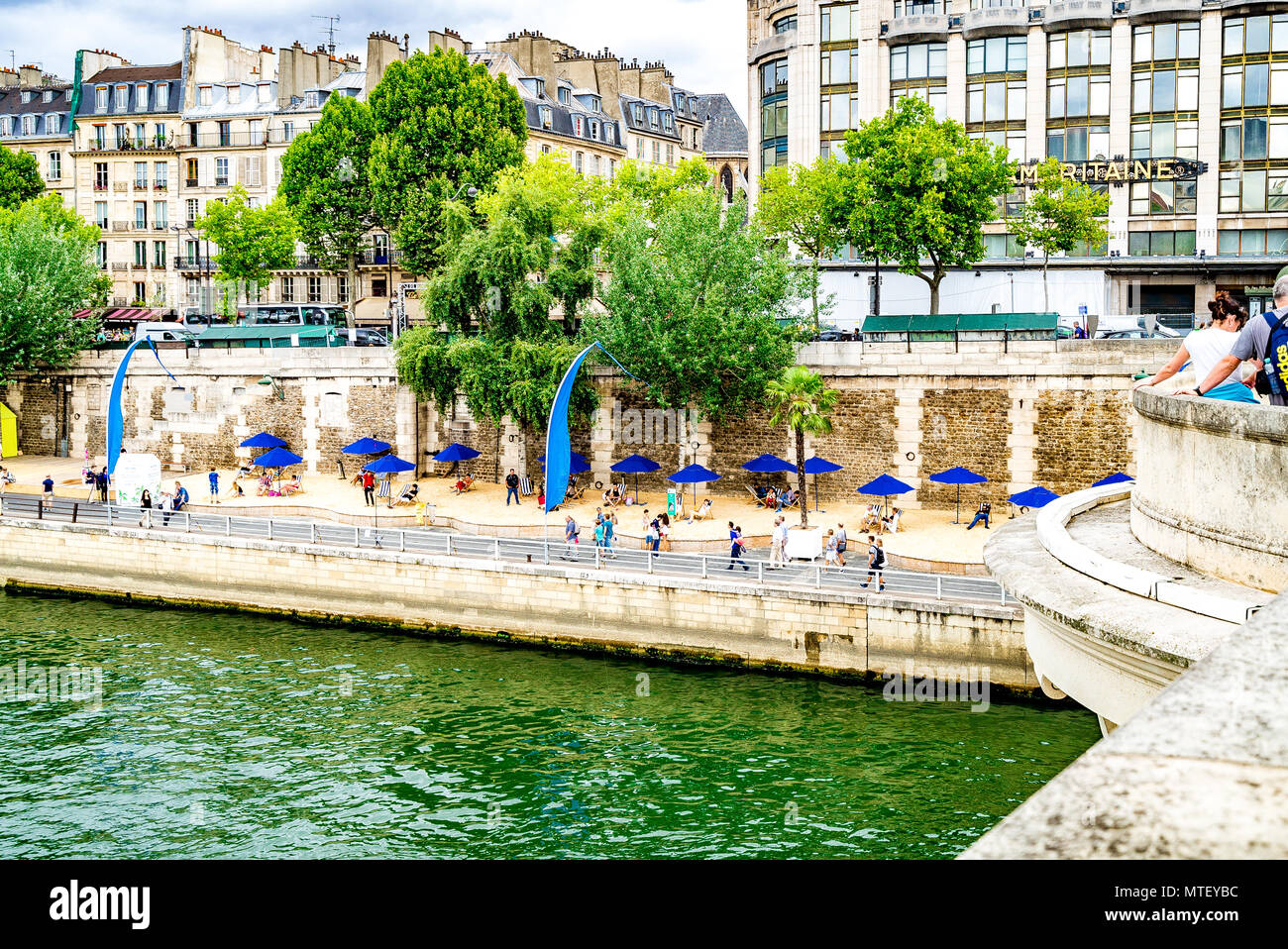 The Paris Plages are temporary artificial beaches each summer along the ...