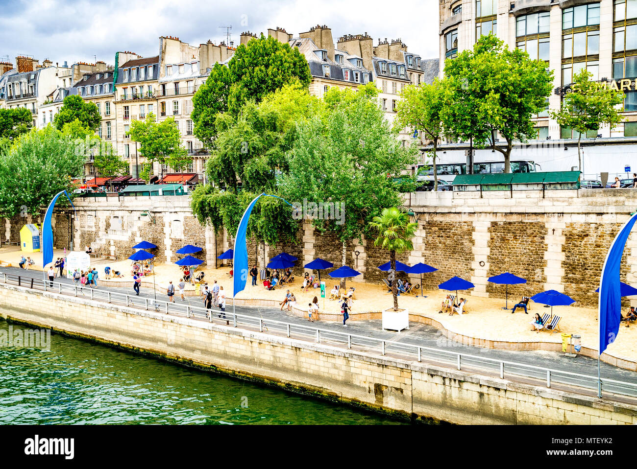 The Paris Plages are temporary artificial beaches each summer along the ...