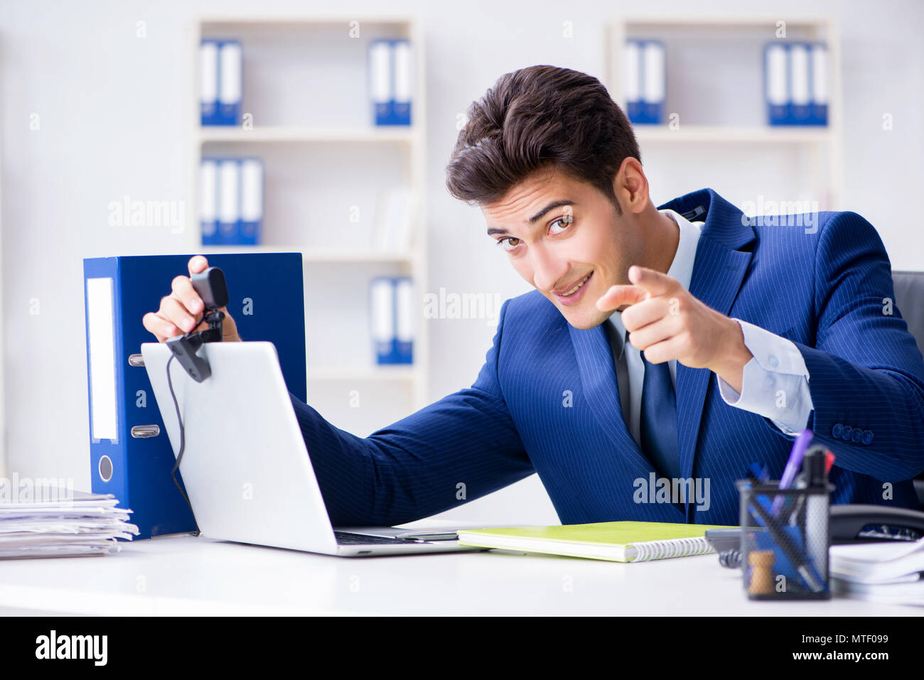 Young help desk operator working in office Stock Photo - Alamy