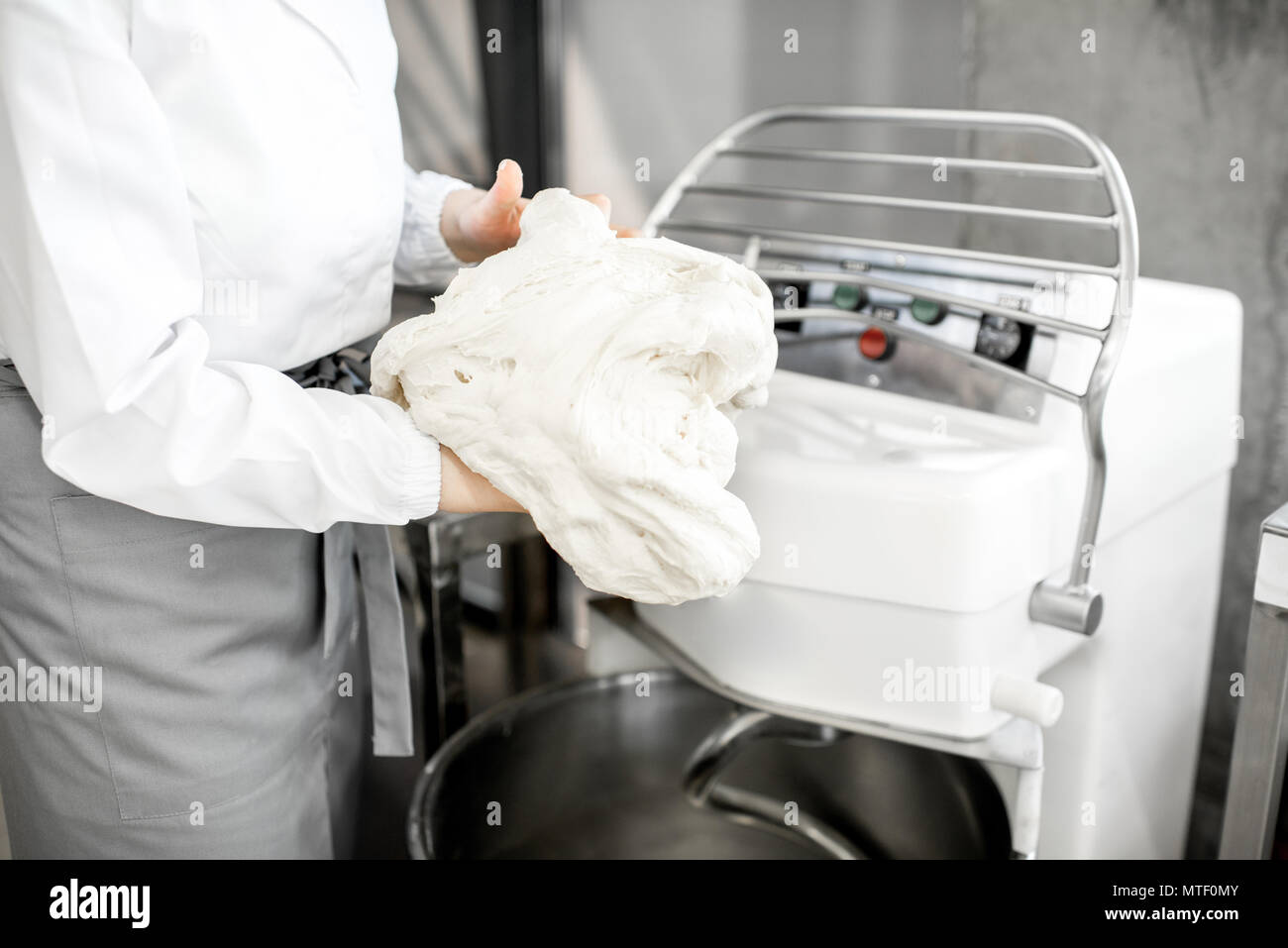 Woman kneading dough bread manufacturing hi-res stock photography and ...