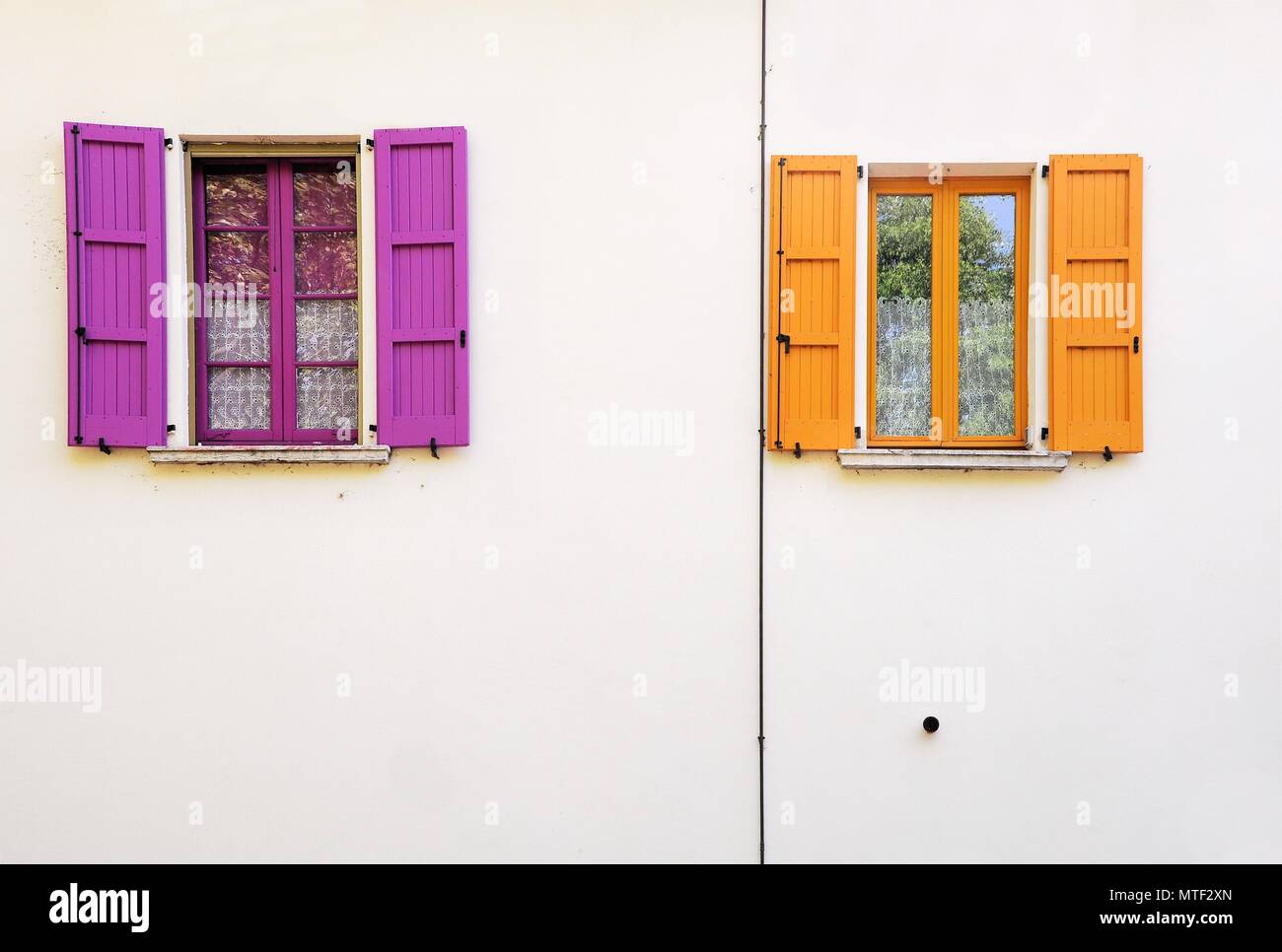 Building facade with colorful windows. Architectural background Stock ...