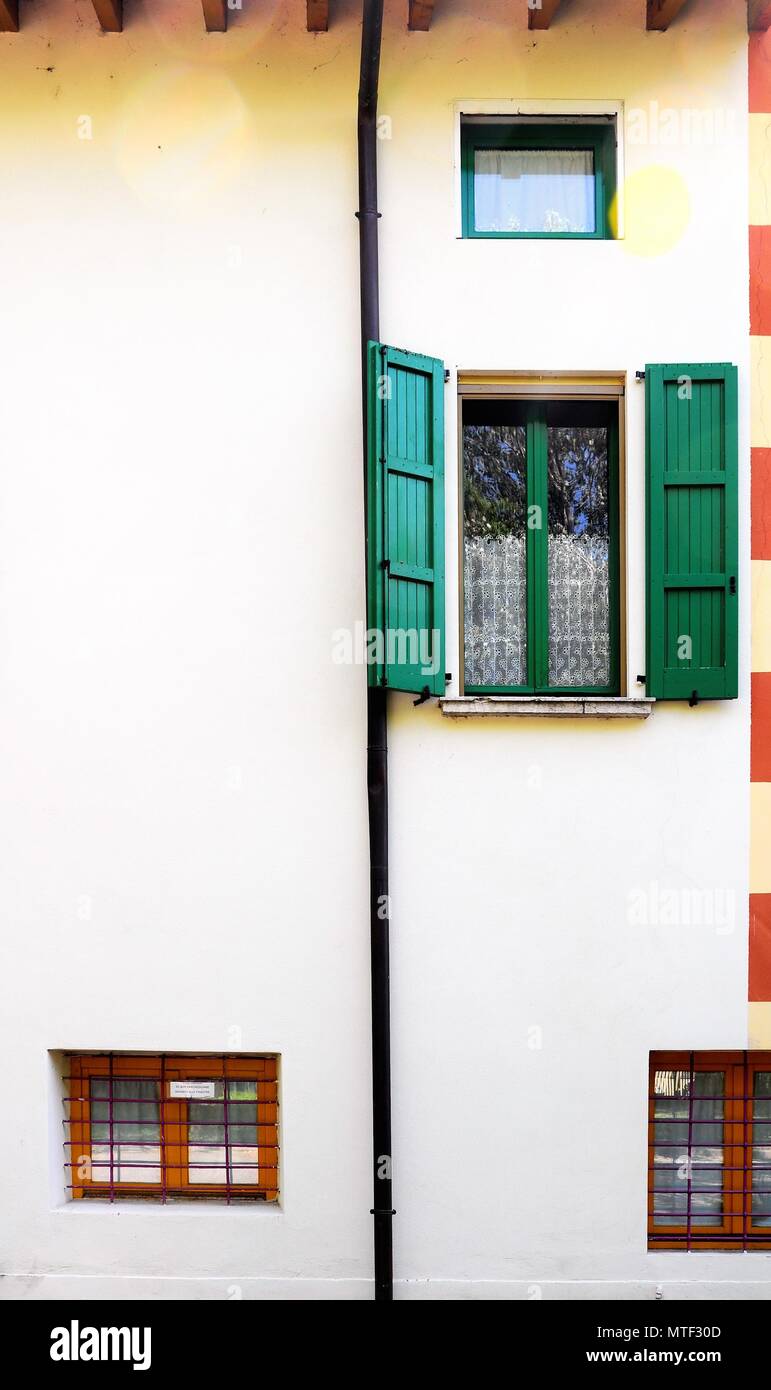 Building facade with colorful windows. Architectural background Stock ...