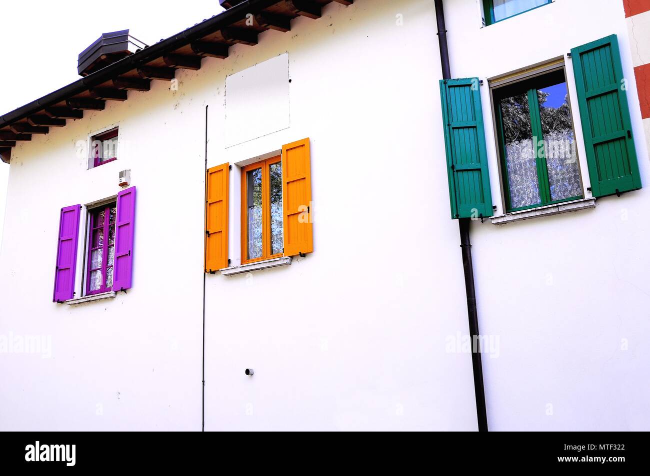 Building facade with colorful windows. Architectural background Stock ...
