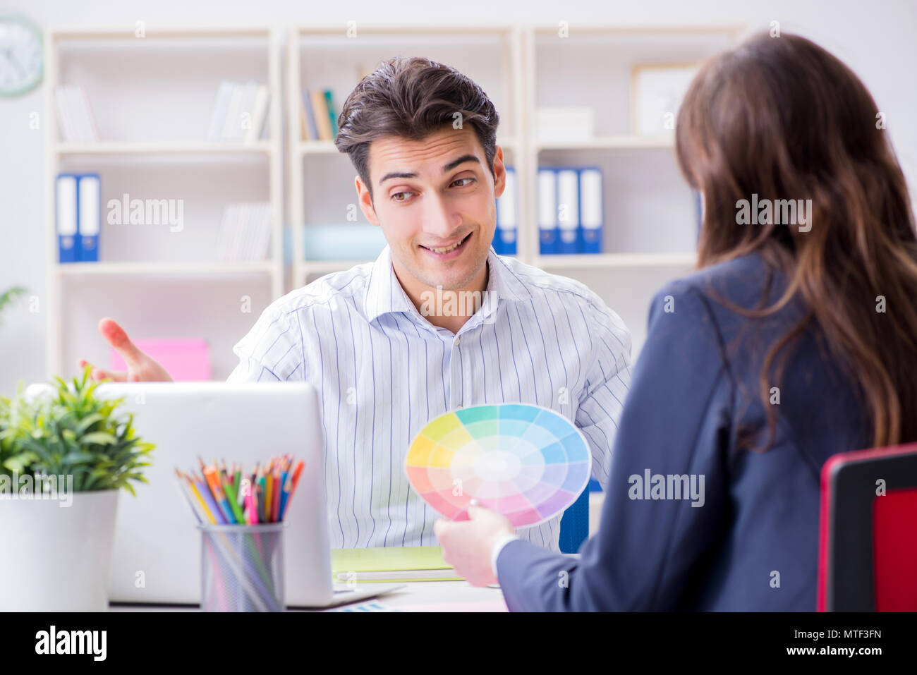 People discussing new design of project Stock Photo - Alamy