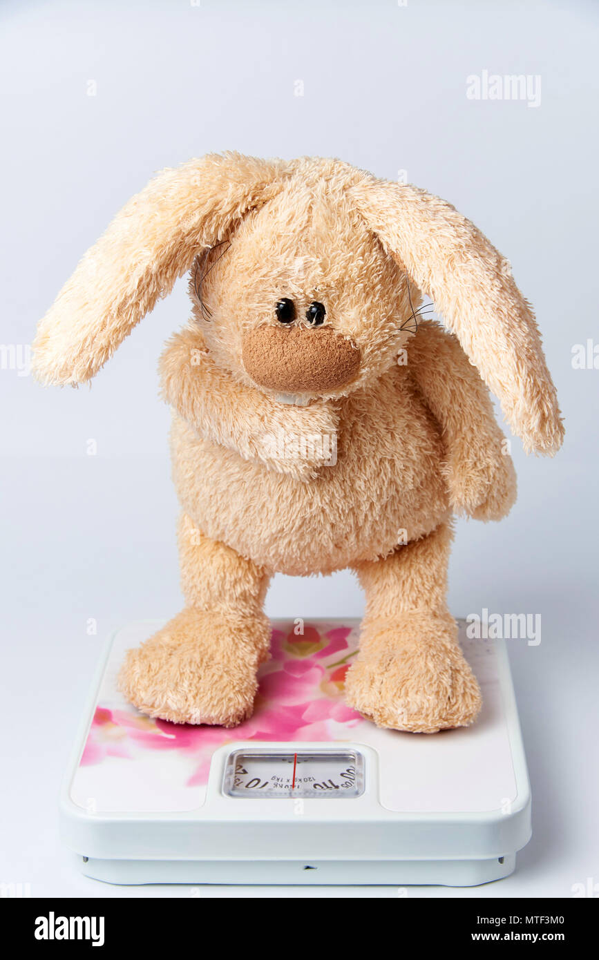 Obese kid scales hi-res stock photography and images - Alamy