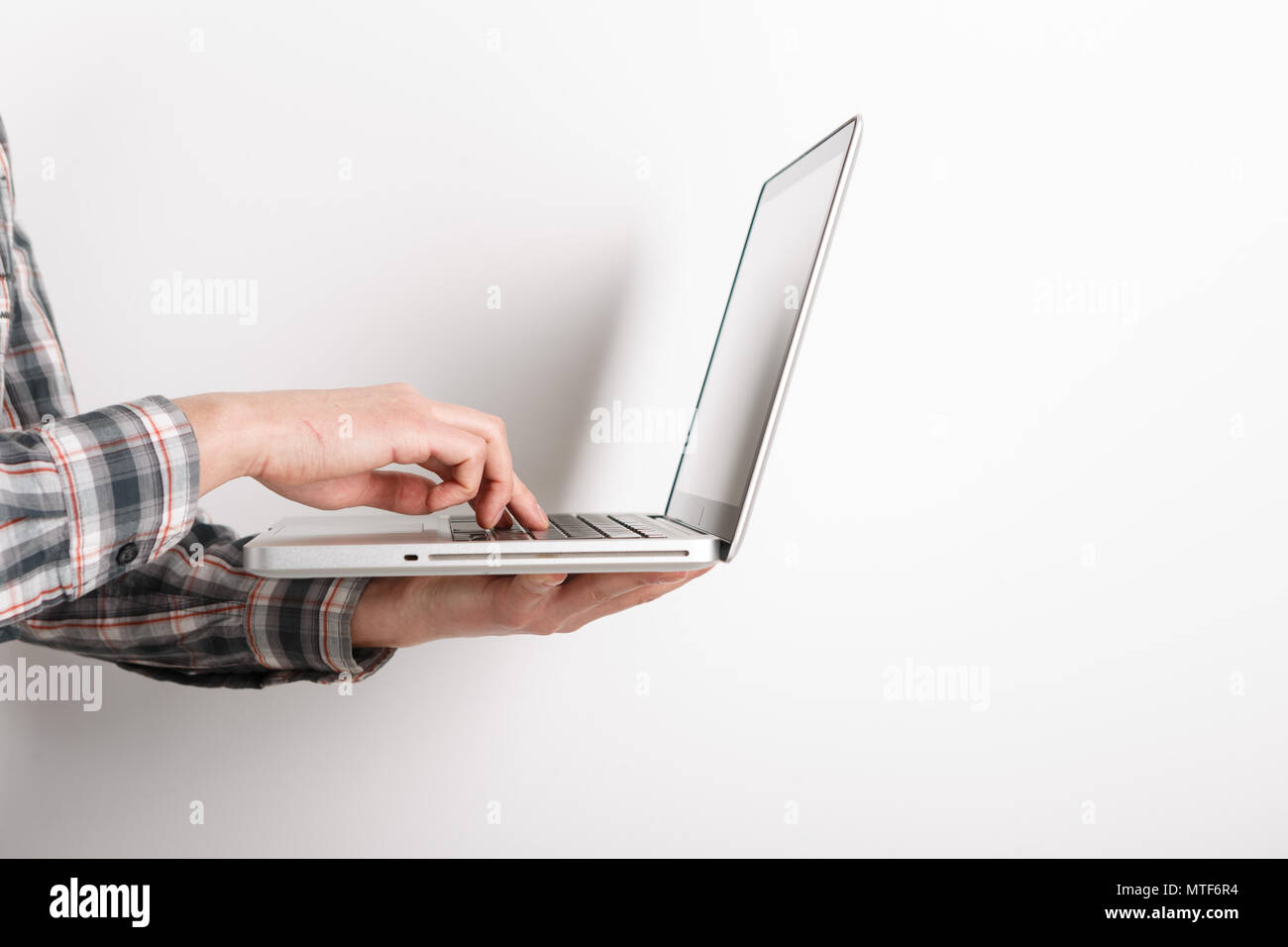 Laptop with man hand isolated on white background Stock Photo - Alamy