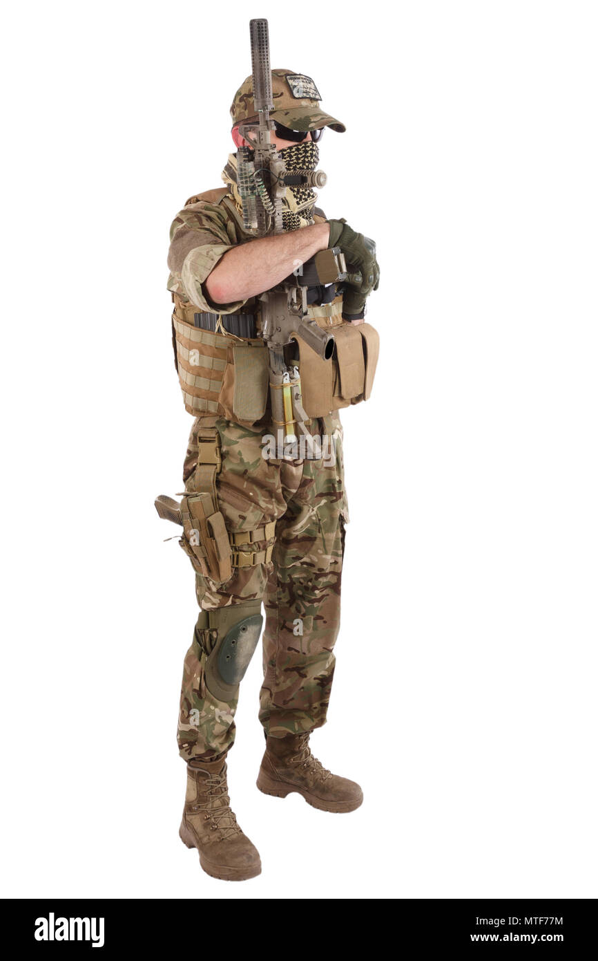 Private Military Company operator with assault rifle on white ...