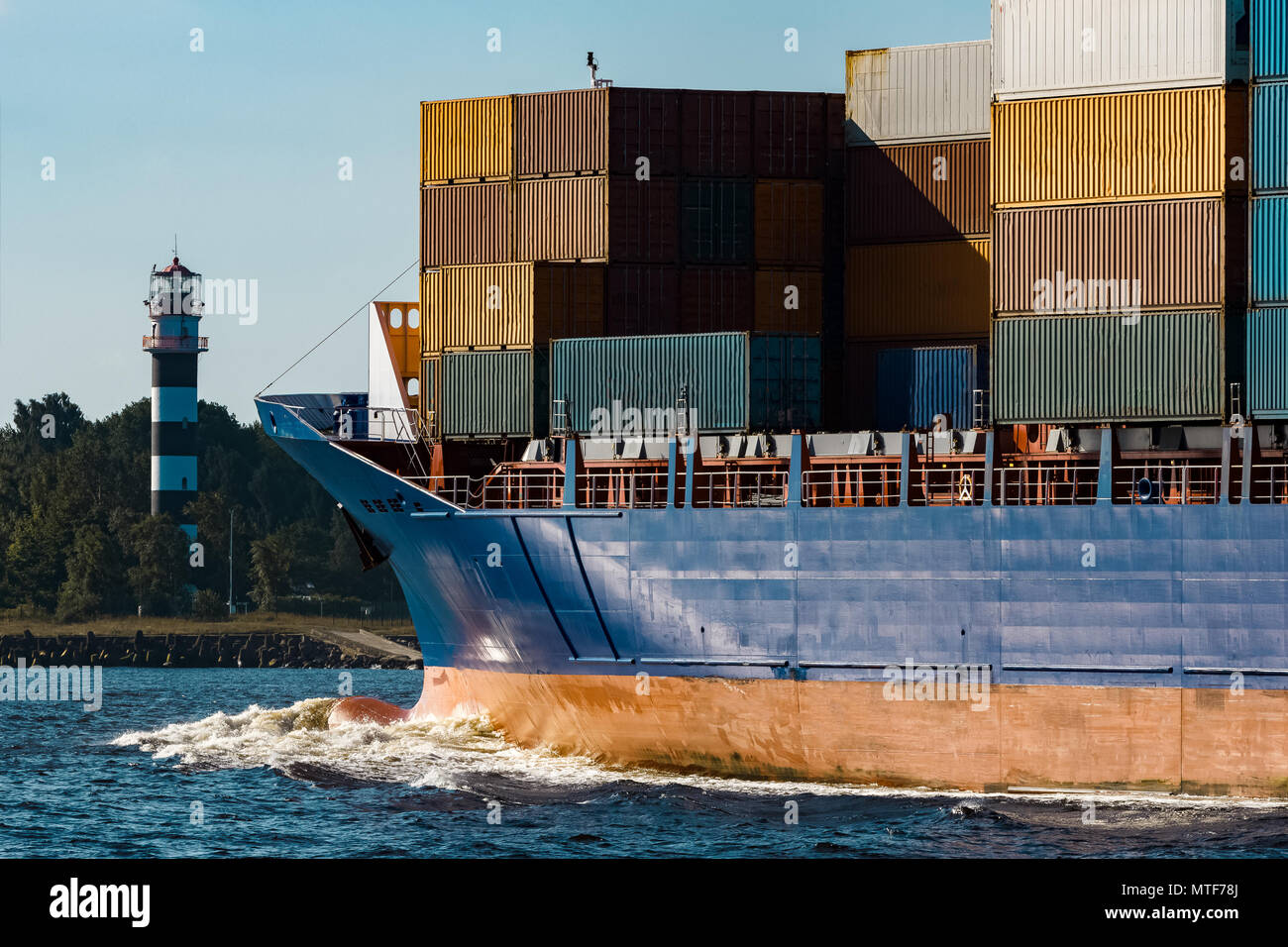 Blue container ship in travel. Logistics and freight industry Stock ...
