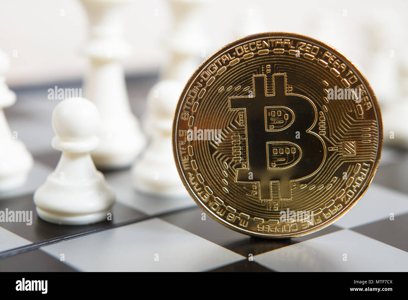 Golden bitcoin coin symbolizes elements of virtual economy or crypto ...