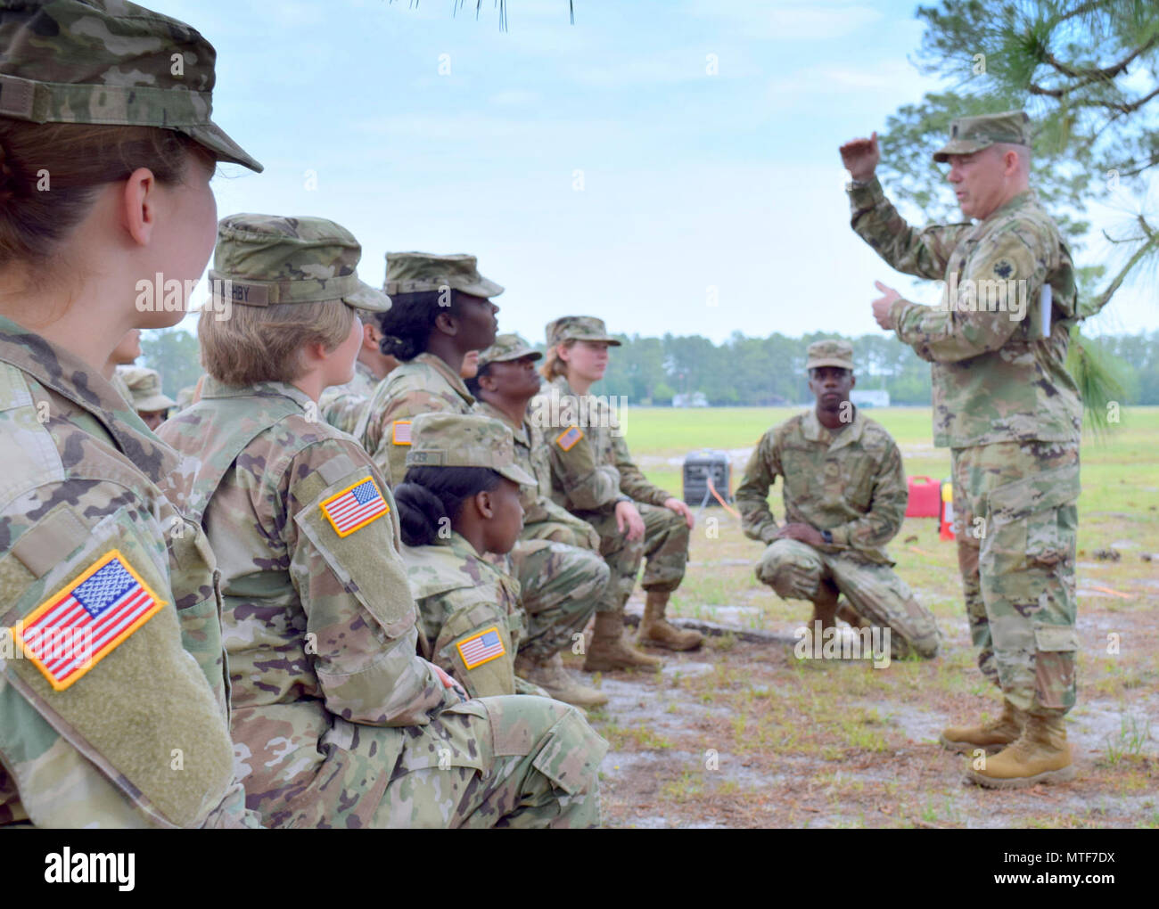 Command Sgt. Major Roy Marchert of the 78th Troop Command congratulates ...